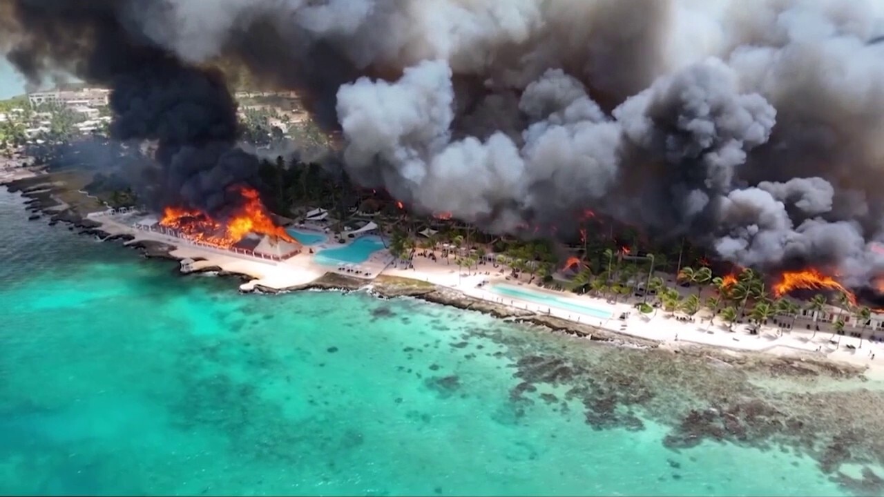 Watch Flames blaze from a fire at the Dominican Republic resort town ...